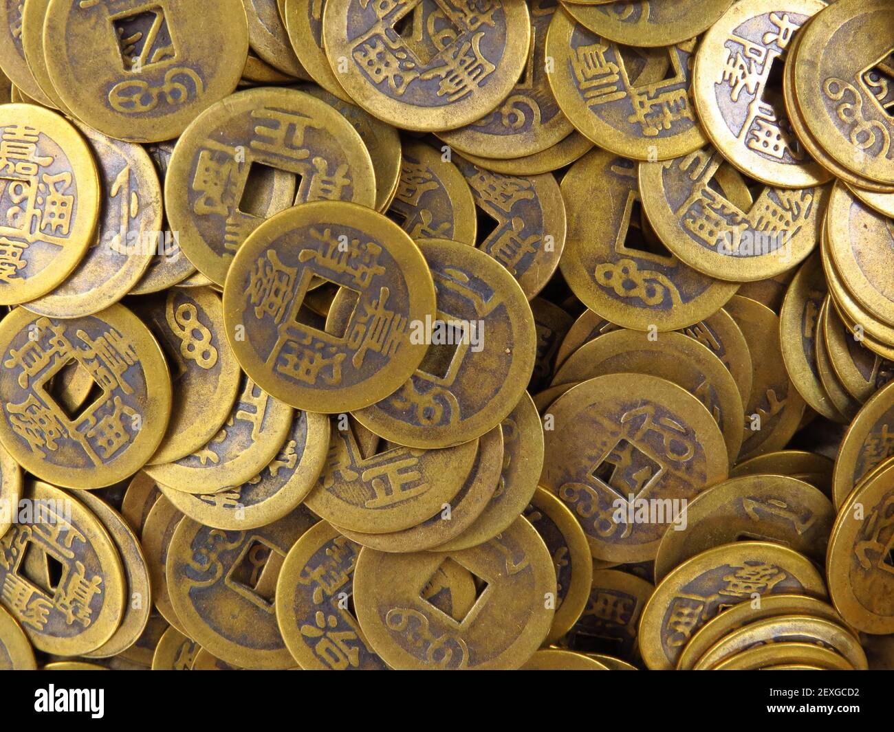 A top view of many old Chinese and East Asian coins called Cash Stock ...