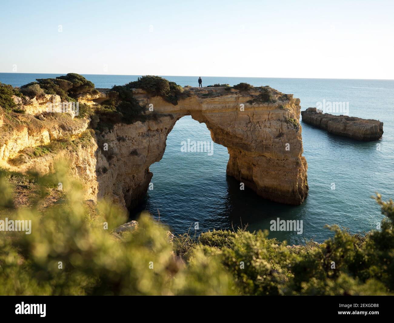 Panorama view of natural limestone arch bridge Arco de Albandeira beach ...