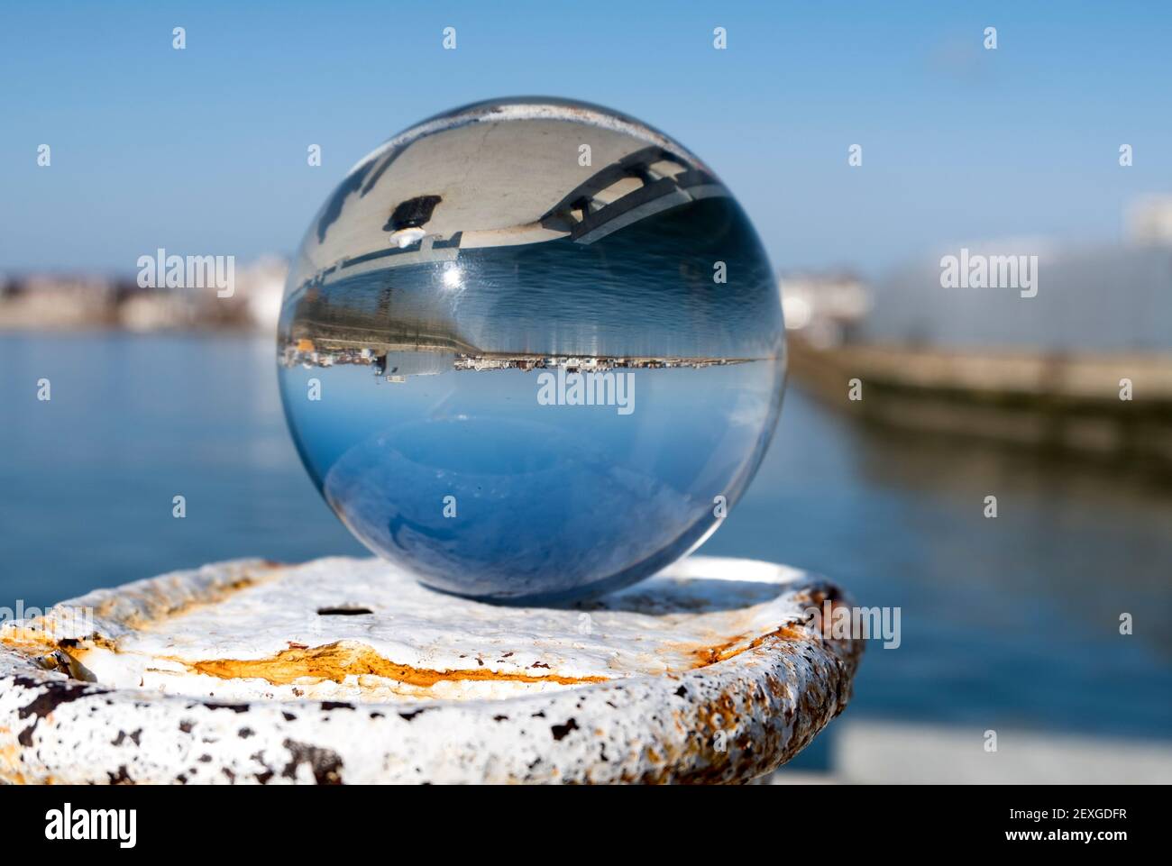 Glass ball scene of a harbor Stock Photo - Alamy
