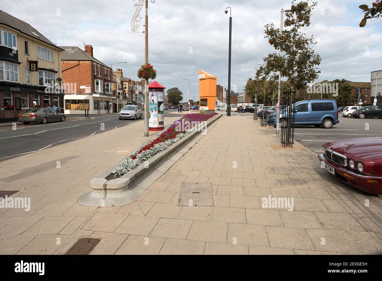 Modern town pavement with flower beds Stock Photo - Alamy