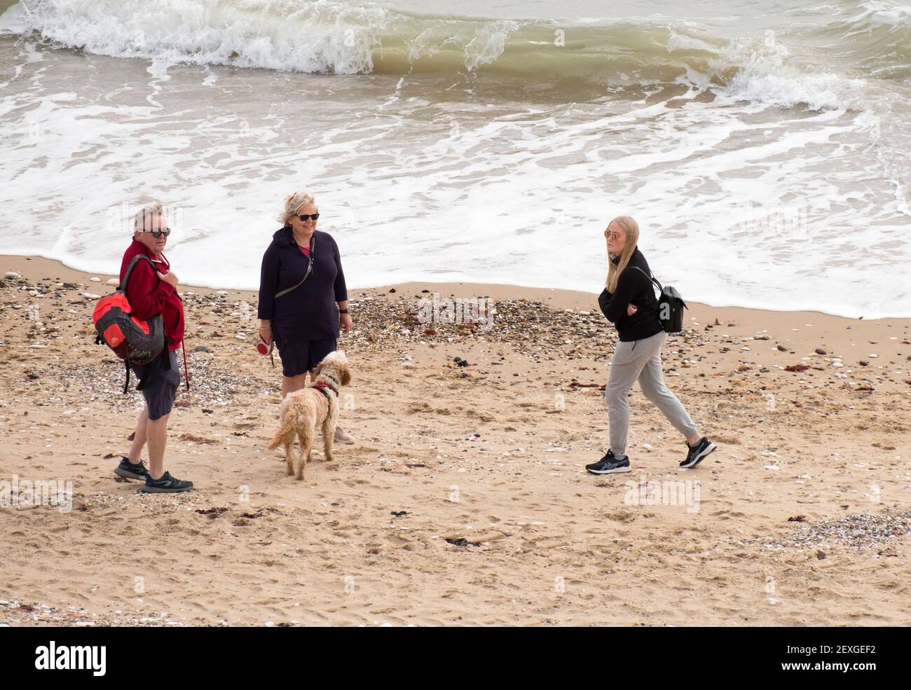 People on a beach example Stock Photo - Alamy