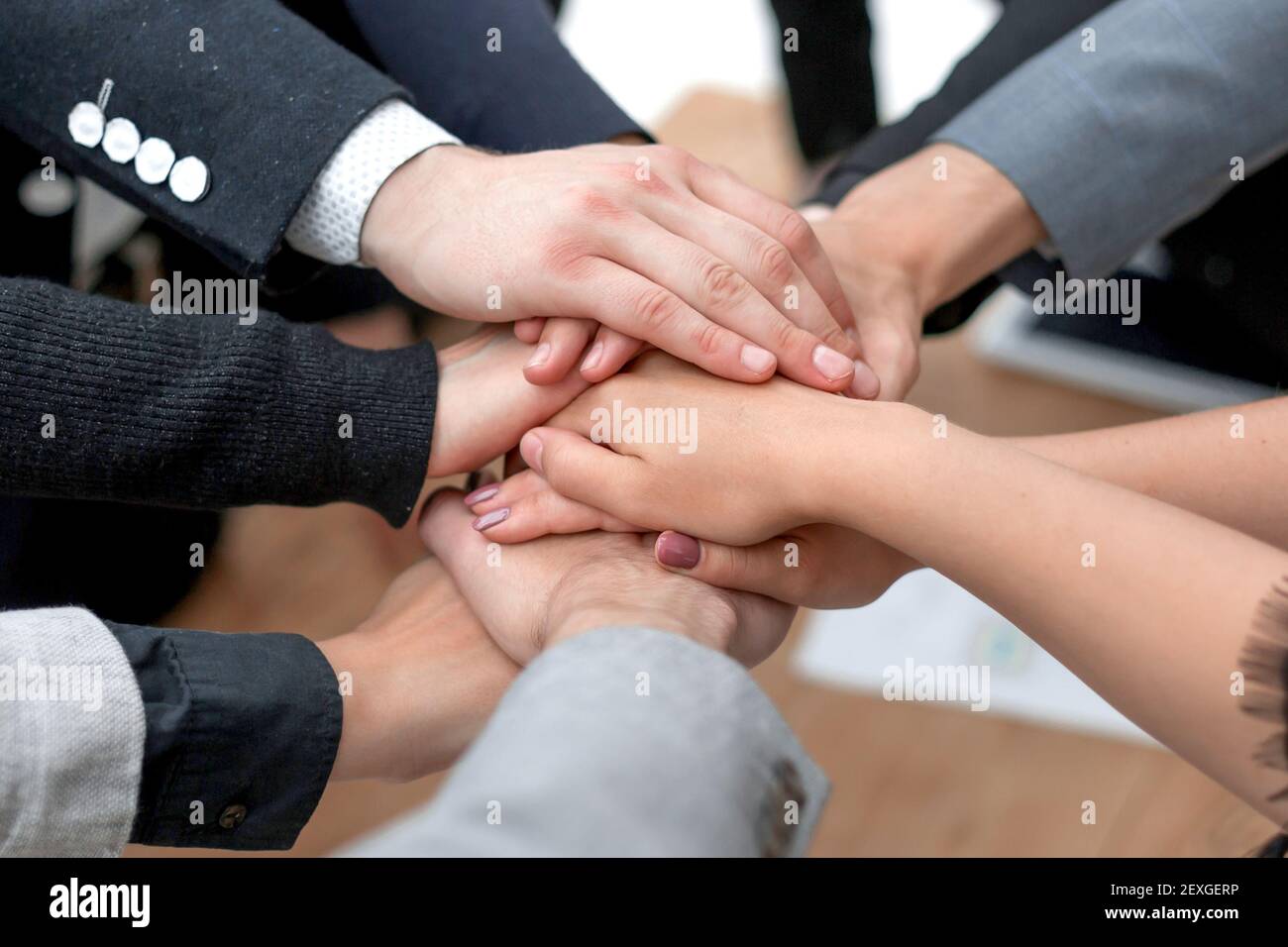 close up. business team putting their hands together Stock Photo - Alamy