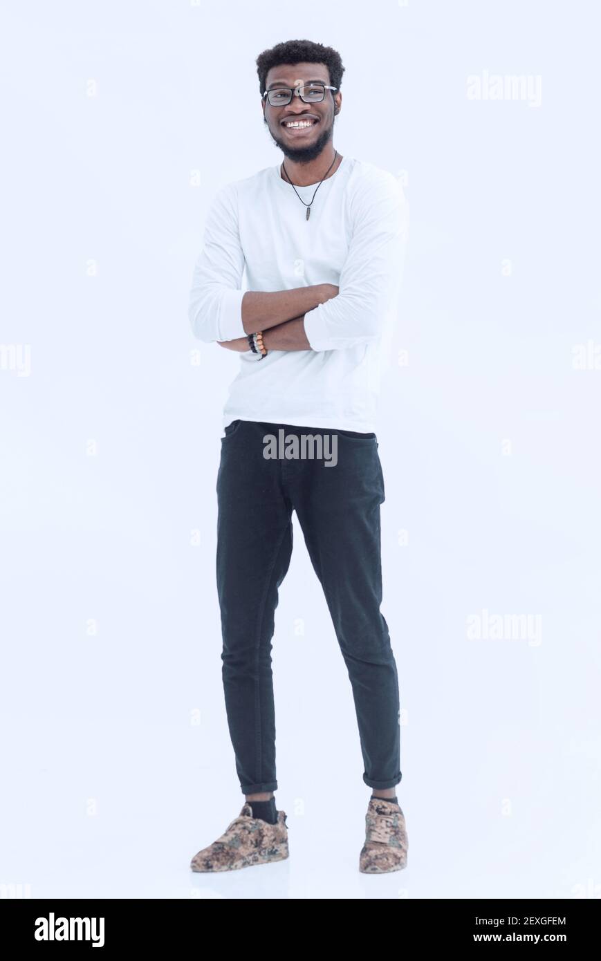 in full growth. portrait of a young smiling man Stock Photo - Alamy