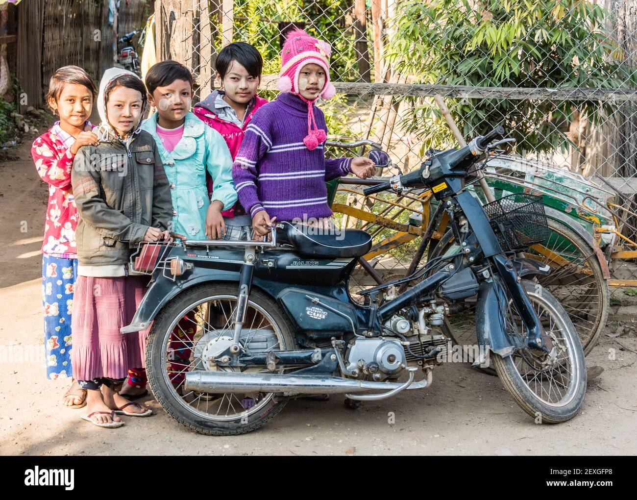 Children standing by motorcycle in Myanmar village Stock Photo - Alamy