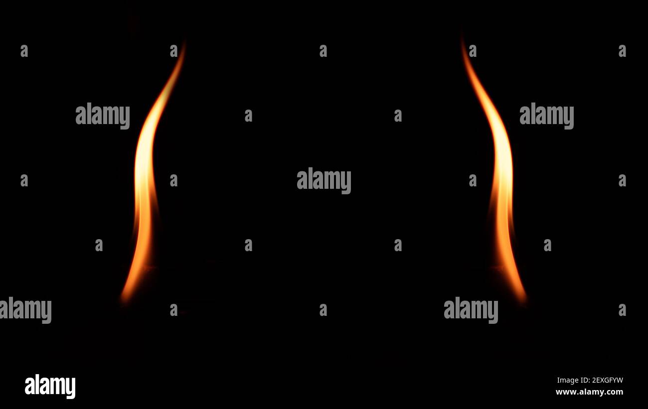 A closeup of the lit-up matches with orange-colored flame and a dark ...