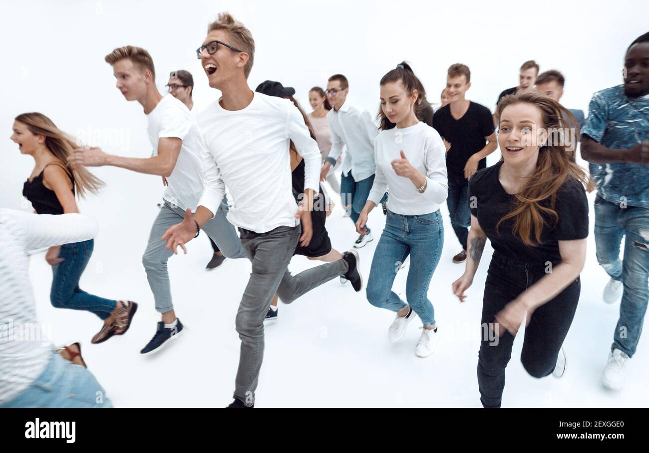 in full growth. a group of young people running forward Stock Photo - Alamy