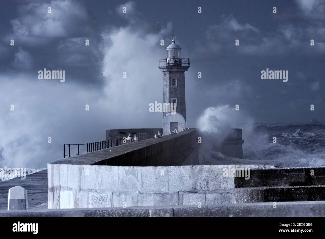 Big wave splash. Douro river mouth old south pier and beacon. Used ...