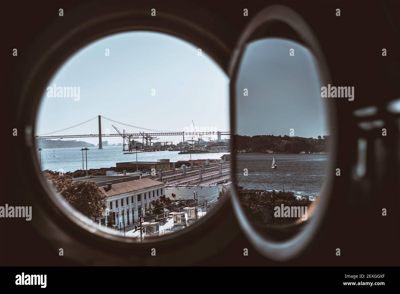 View through a round opened porthole of a traveling cruise ship of a ...