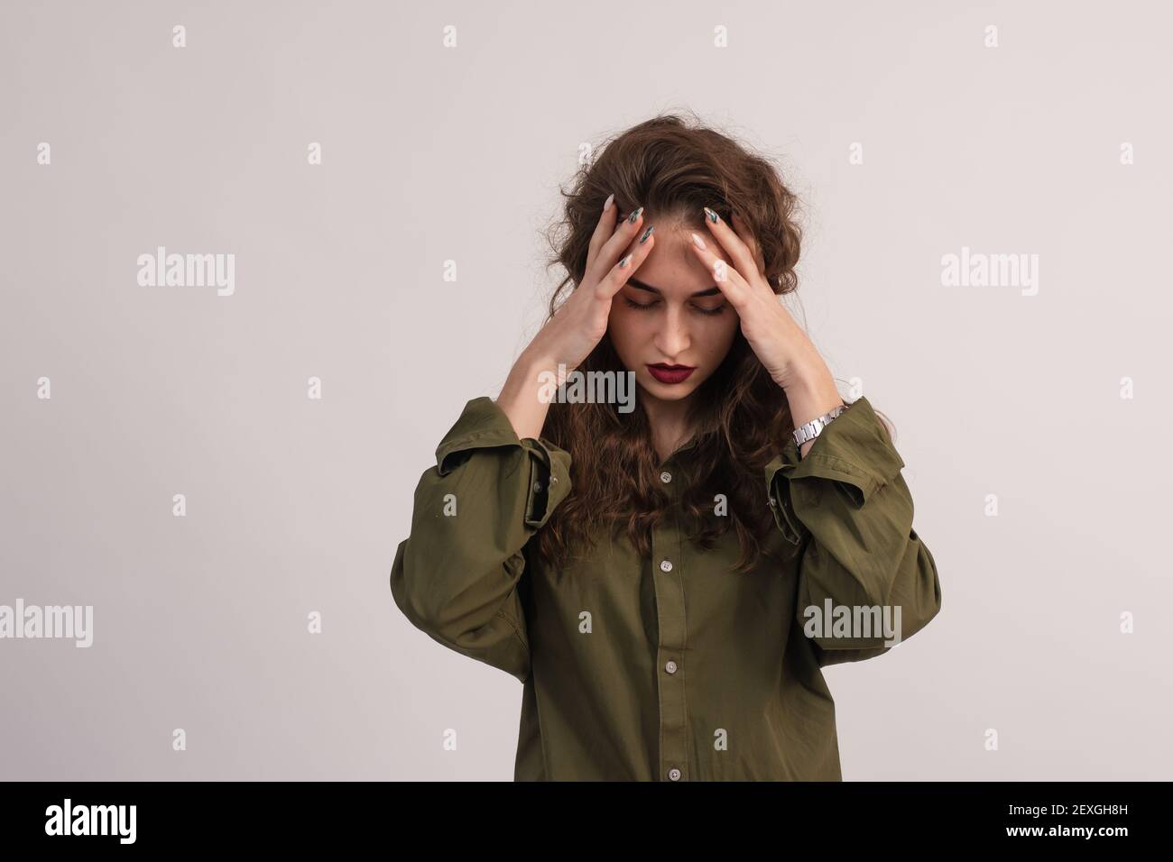 A beautiful girl has a migraine and a headache. space for writing Stock ...