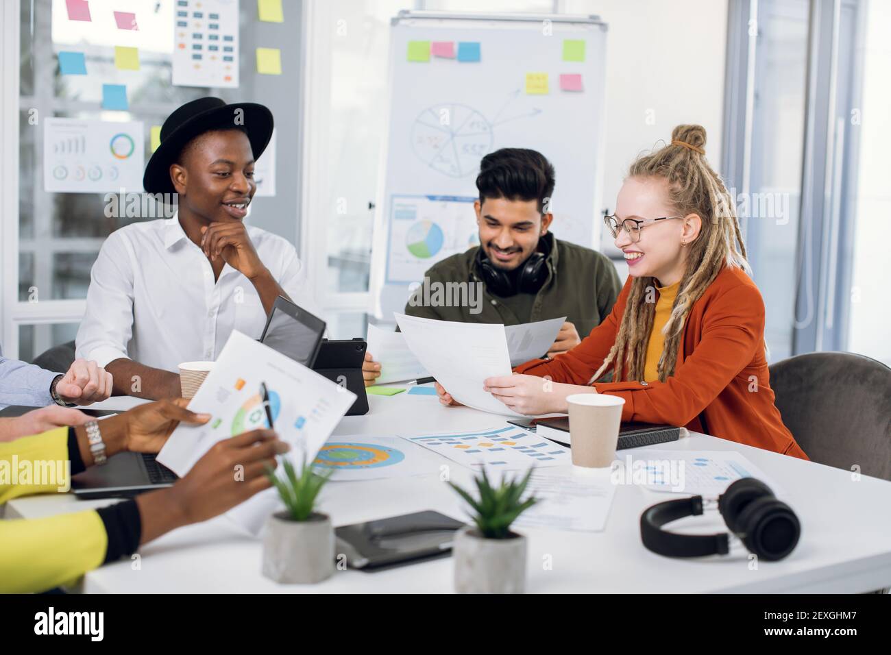 Creative multicultural team sitting hi-res stock photography and images ...