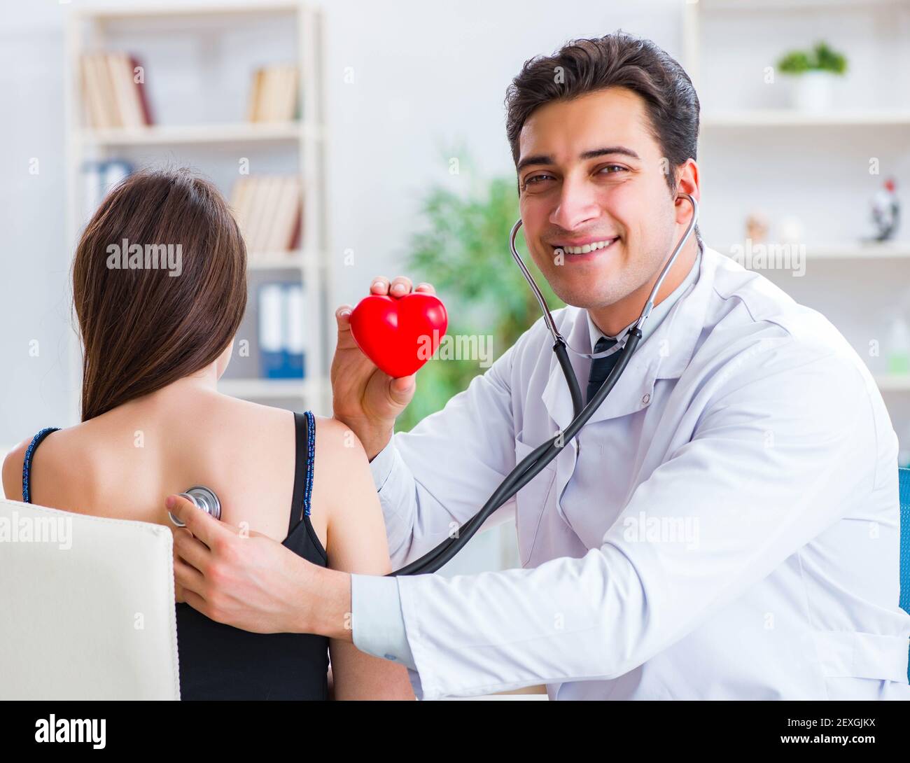 The doctor checking patient with stethoscope Stock Photo - Alamy