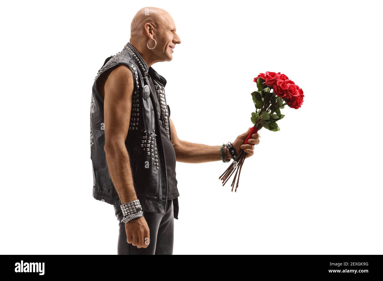 Punk giving a bunch of red roses isolated on white background Stock ...