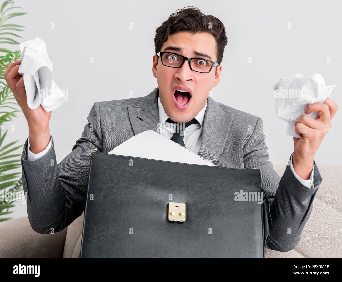 The angry businessman with crumbled paper Stock Photo - Alamy