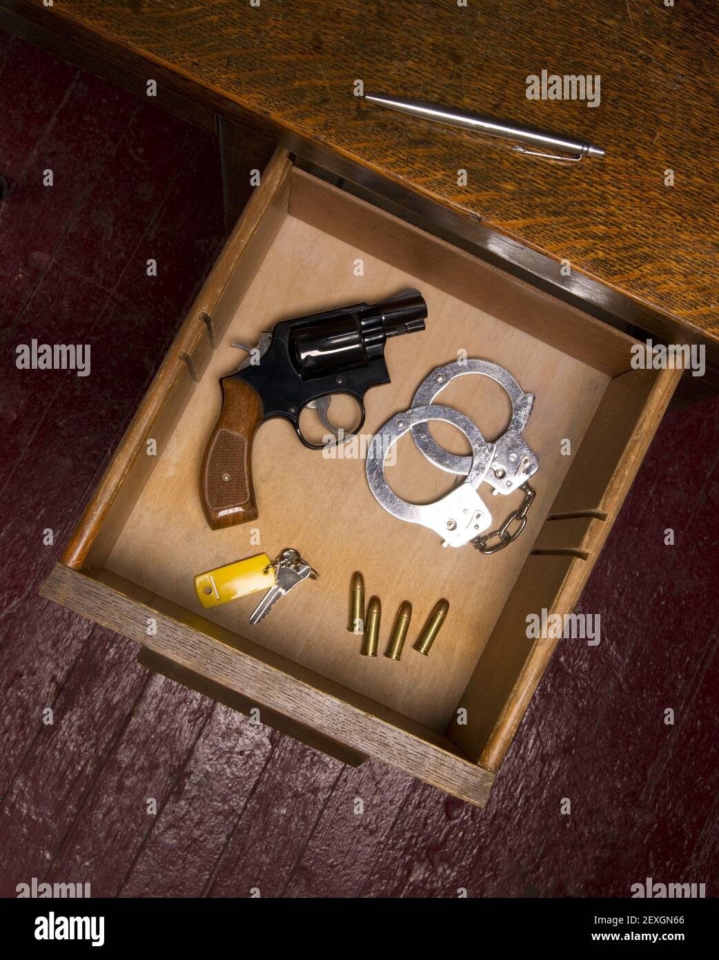 Desk Drawer Full of Self Defense Items and Gun Stock Photo - Alamy