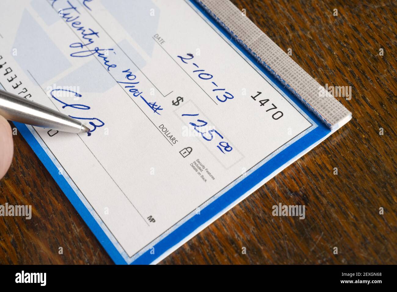 Hand writing cheque hi-res stock photography and images - Alamy