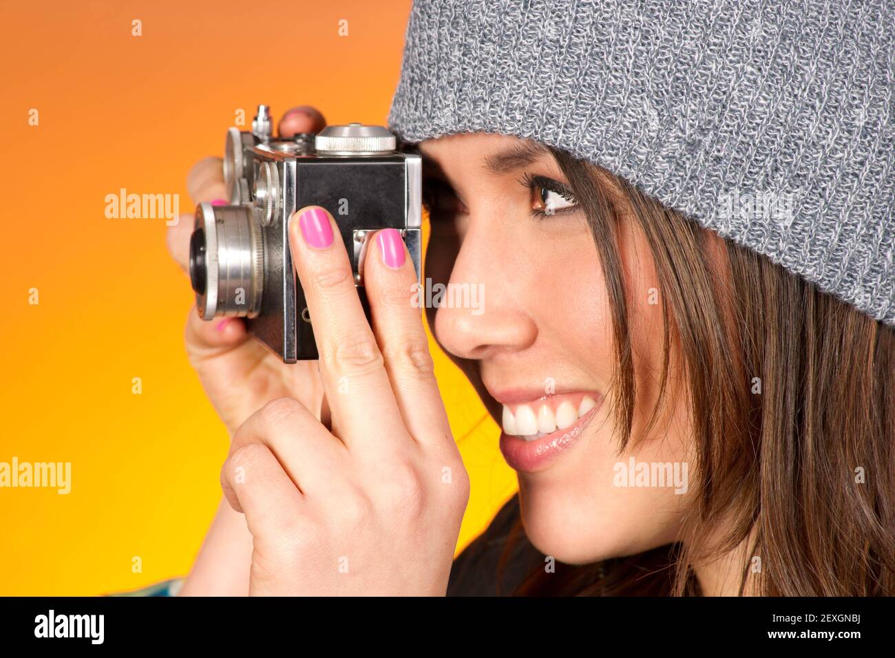 Hip Woman Snaps a Picture with Vintage Camera Stock Photo - Alamy