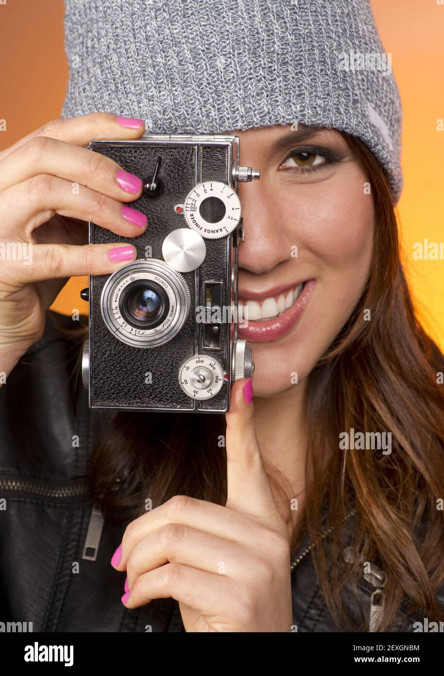 Woman Looks Right at the Camera taking a picture too Stock Photo - Alamy