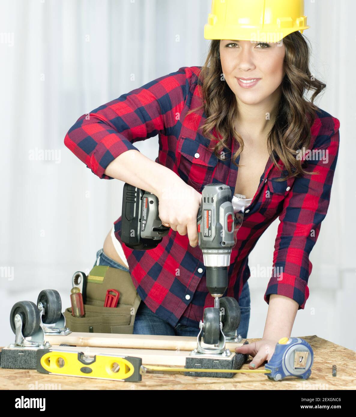 Woman Works on a Bench Repairing A Dolly Stock Photo - Alamy