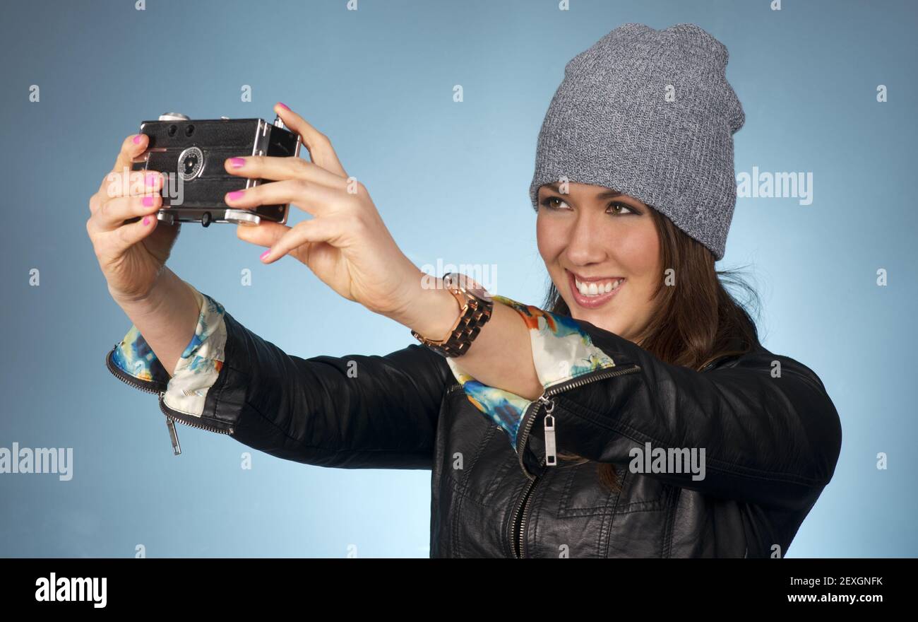 Hip Woman Snaps a Picture of Herself with Vintage Camera Stock Photo ...