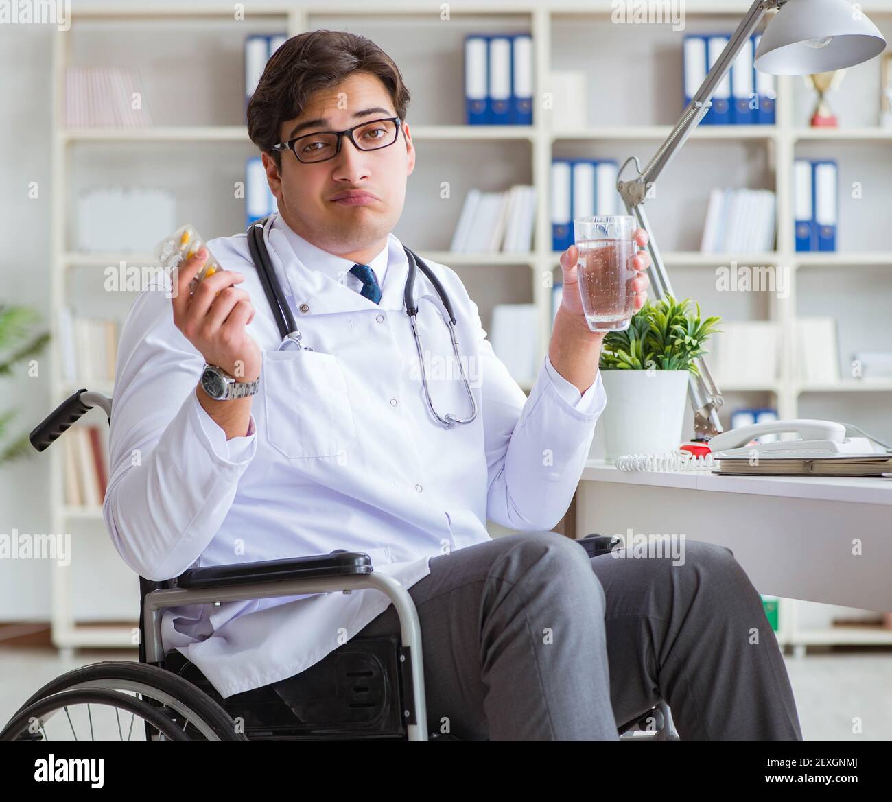 The disabled doctor on wheelchair working in hospital Stock Photo - Alamy