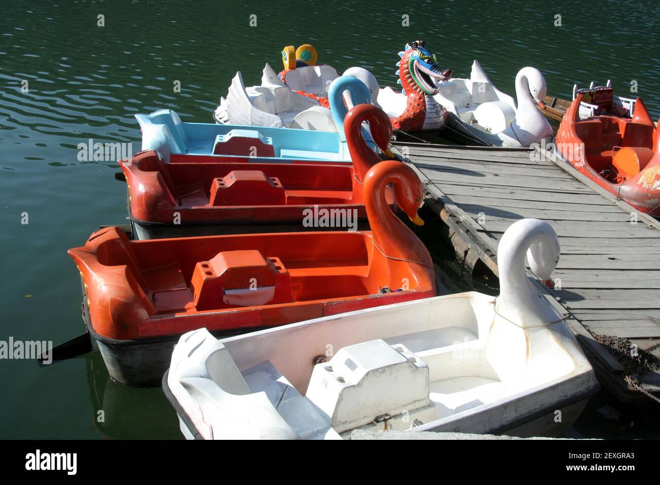 The colorful boats with animal heads in the park at sunny day Stock ...
