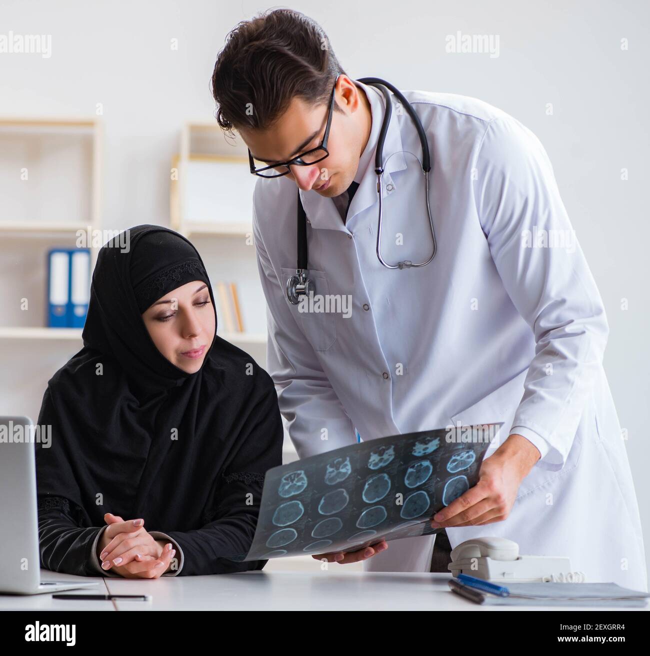 The muslim woman visiting doctor for regular check-up Stock Photo - Alamy