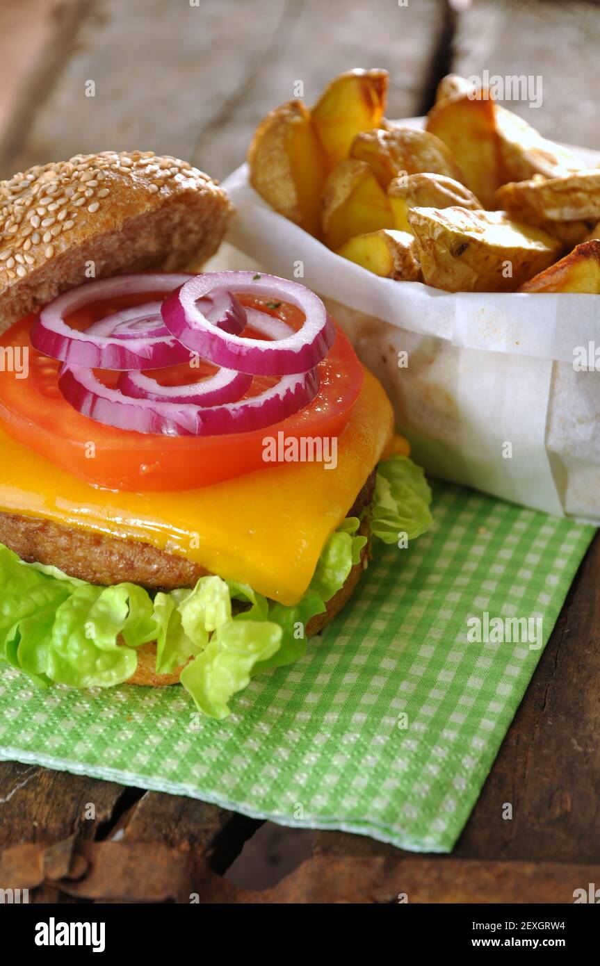 Homemade burger and potatoe wedges Stock Photo - Alamy