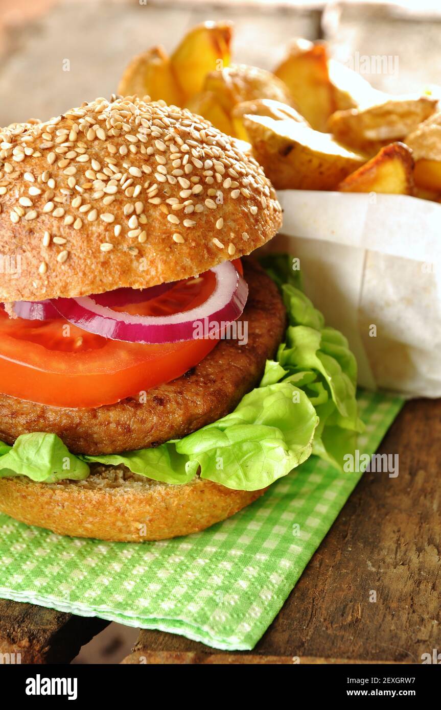 Food: Homemade Veggie Burger and Potatoe Wedges Stock Photo - Alamy
