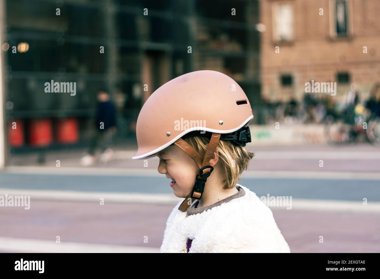 Little girl 3-4 years old in a helmet crying in a skate park Stock ...