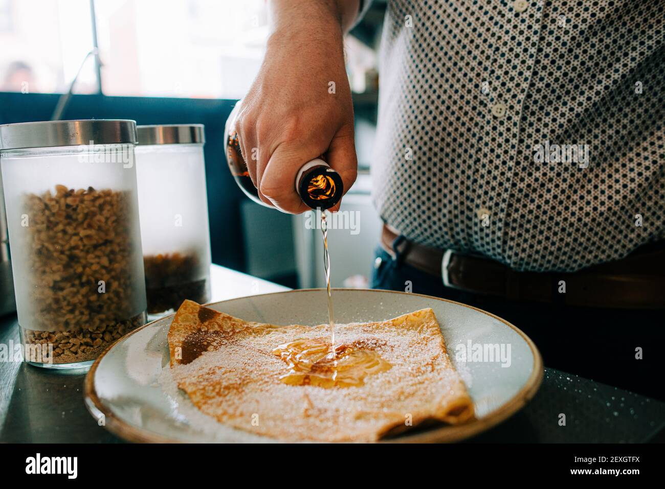 Hand Pouring Syrup High Resolution Stock Photography and Images - Alamy