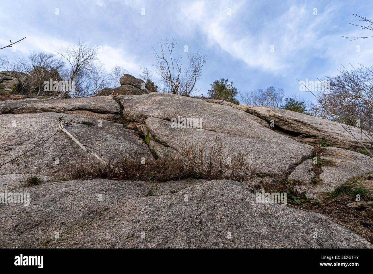 A low angle shot of big rock formations on a cliff in the mountain ...