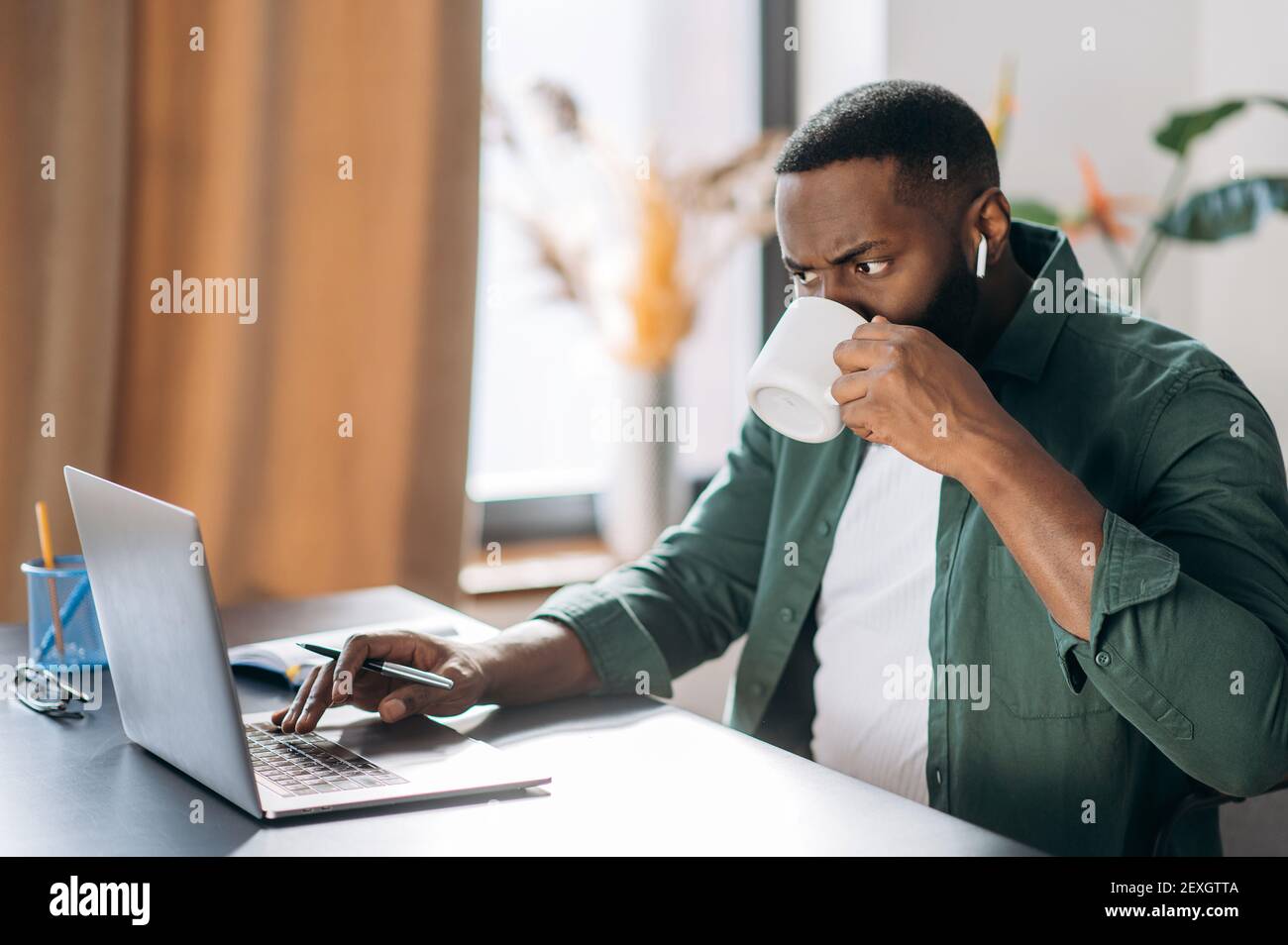 Concentrated serious busy successful African American ceo, programmer ...