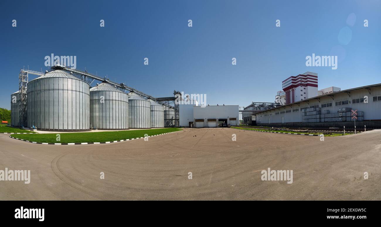 Modern animal feed factory. Panoramic view of new granaries, big metal ...