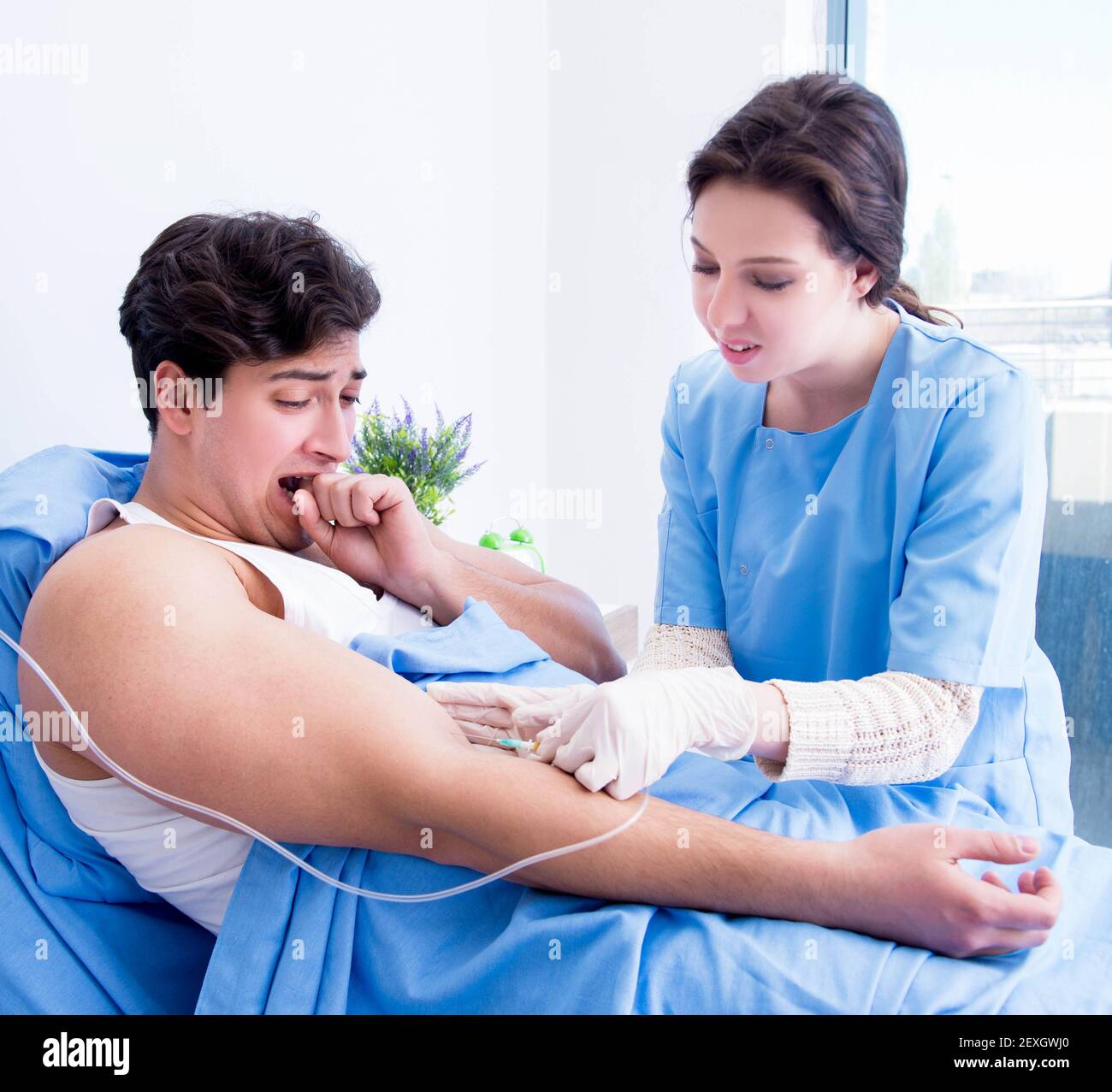 The doctor doing medical injection in hospital room Stock Photo - Alamy