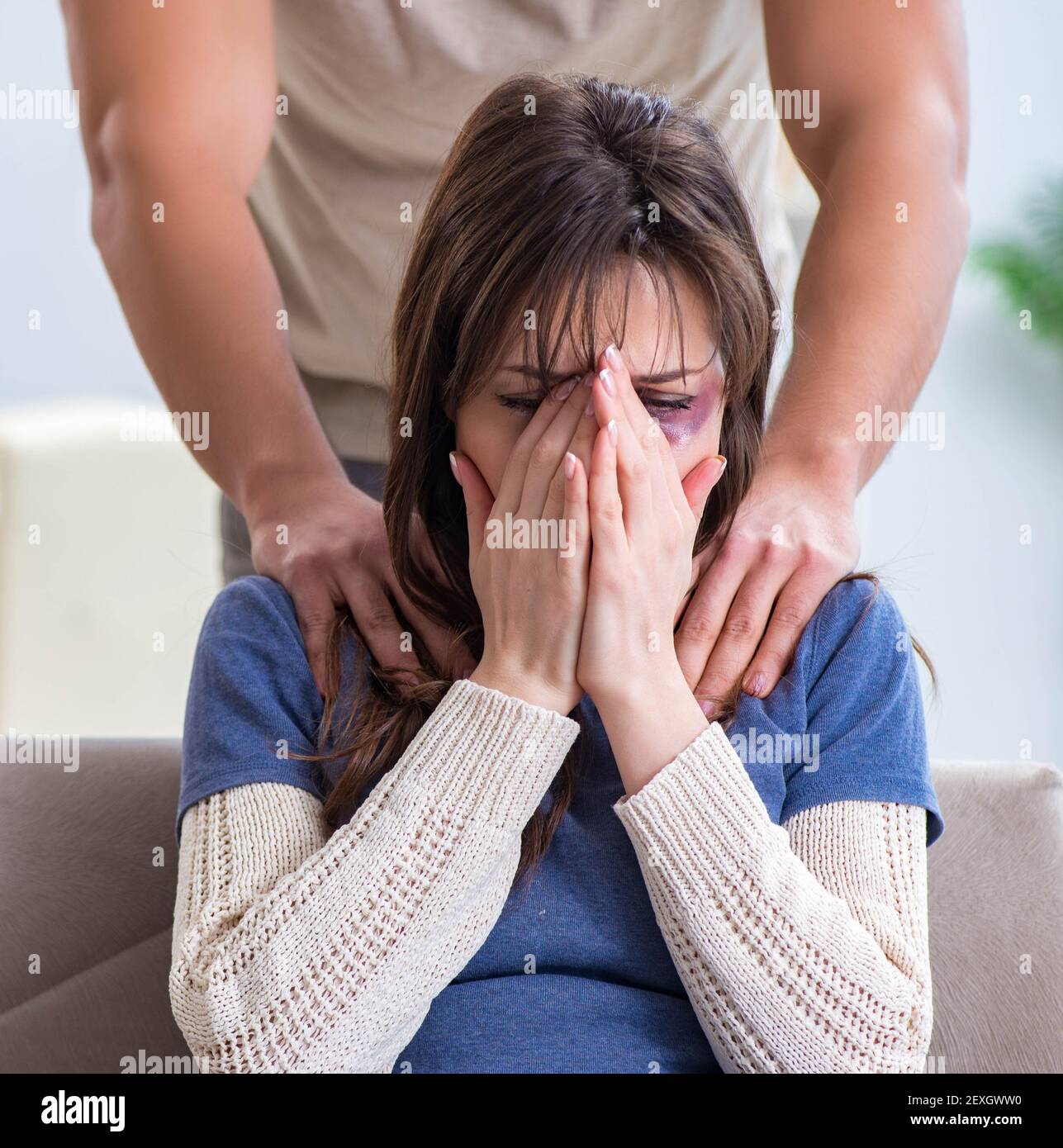 Desparate wife with aggressive husband in domestic violence concept ...