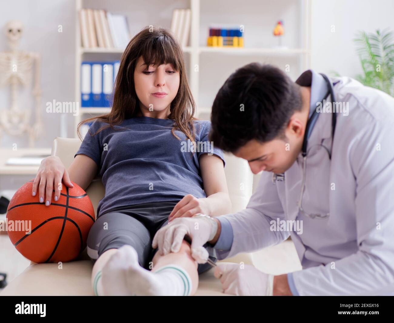 The female basketball player visiting doctor after injury Stock Photo ...