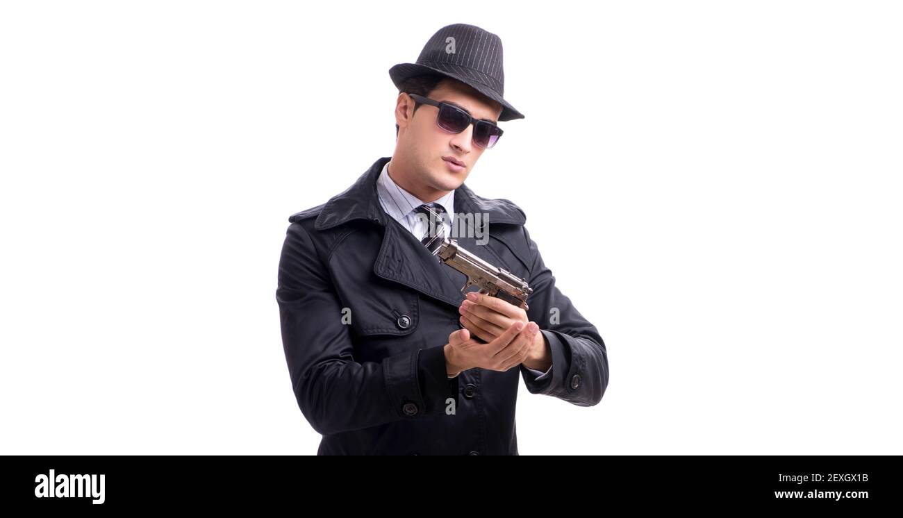 The man spy with handgun isolated on white background Stock Photo - Alamy