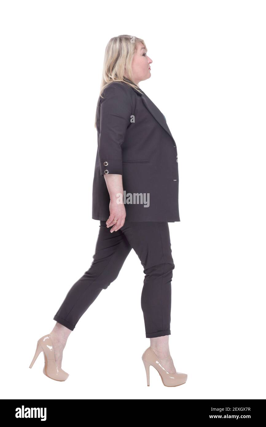 confident woman in a summer pantsuit striding forward Stock Photo - Alamy