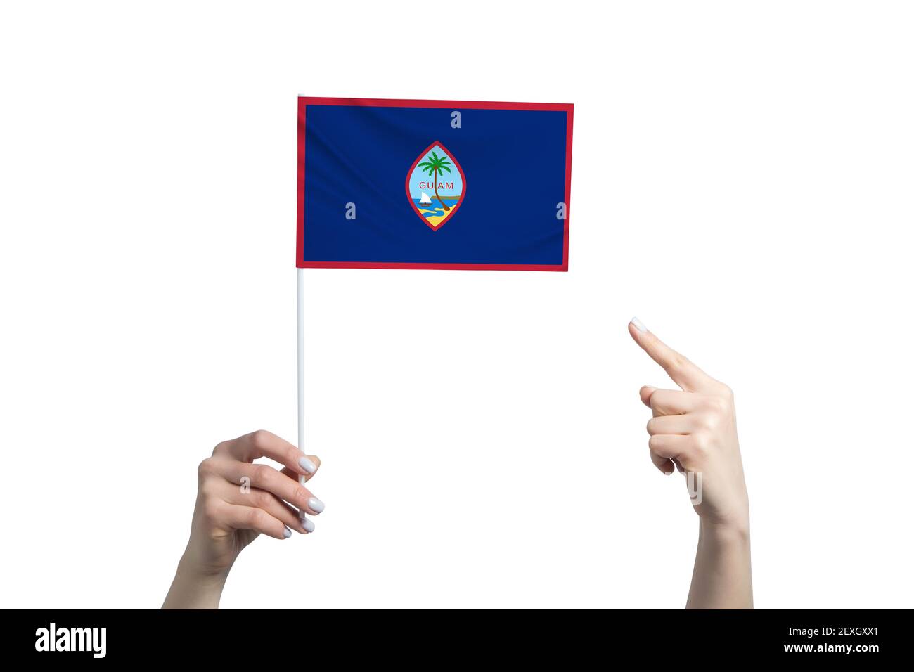 A beautiful female hand holds a Guam flag to which she shows the finger ...