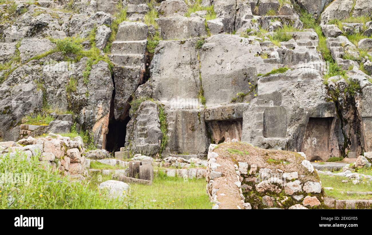 Inca ruins at temple to the moon, steps and windows carved cliff in ...