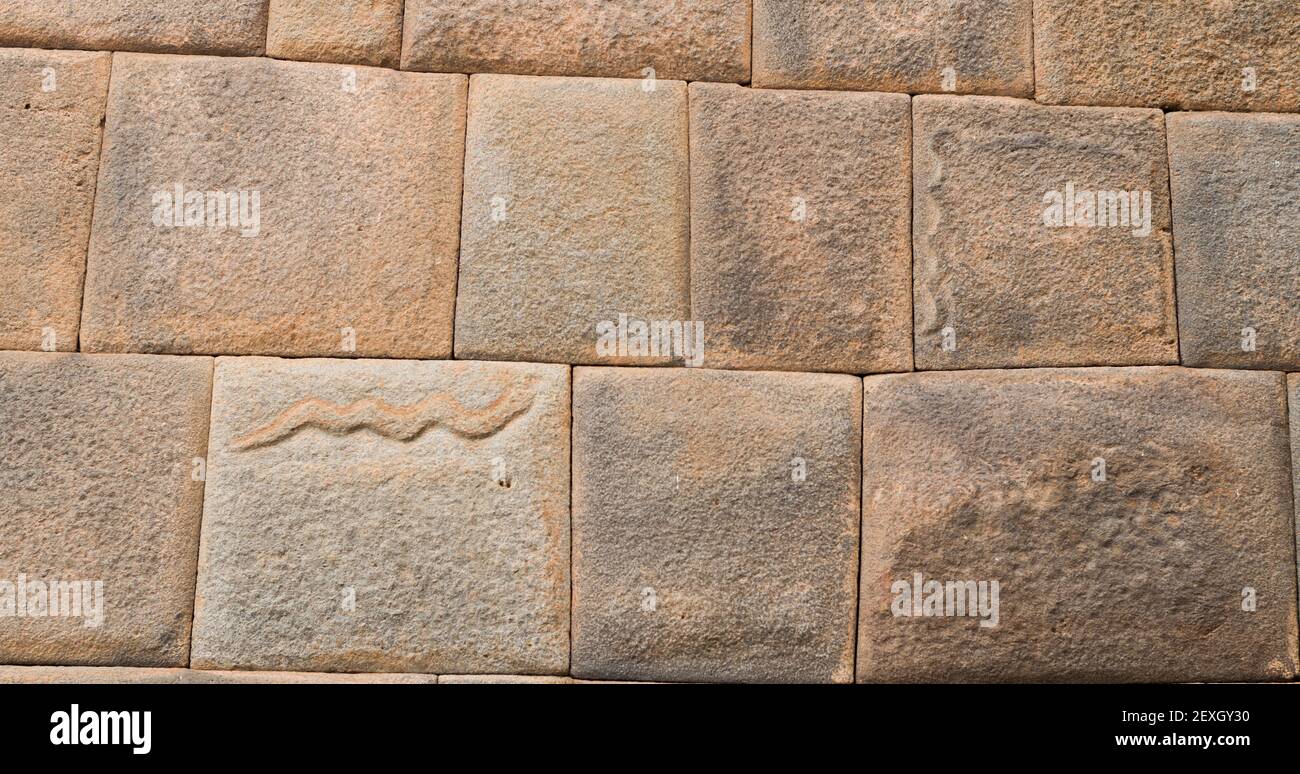 7 snakes carved on stone wall in cusco imperial city, Peru Stock Photo ...