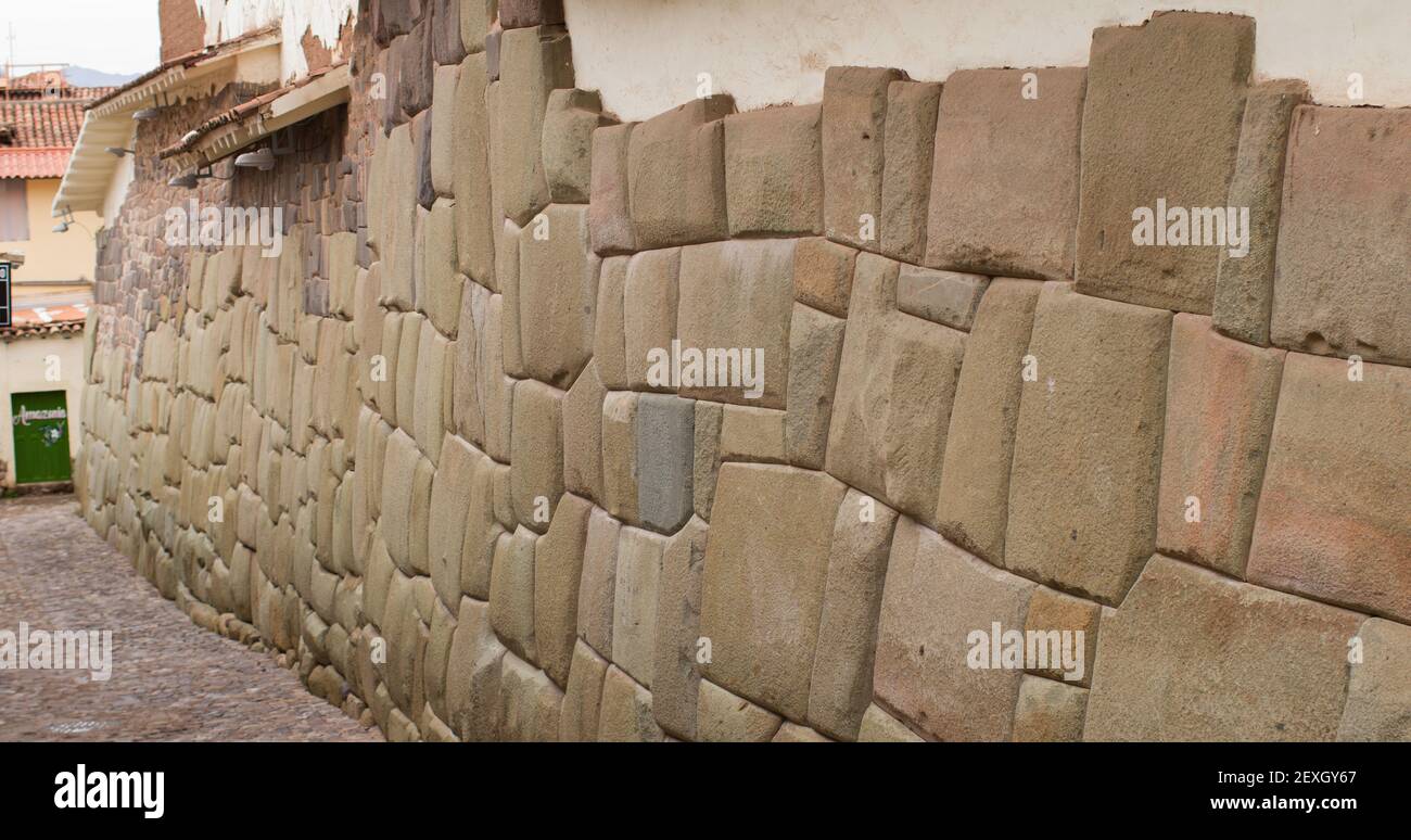 Megalithic stone walls down ancient street in ancient city of cusco ...