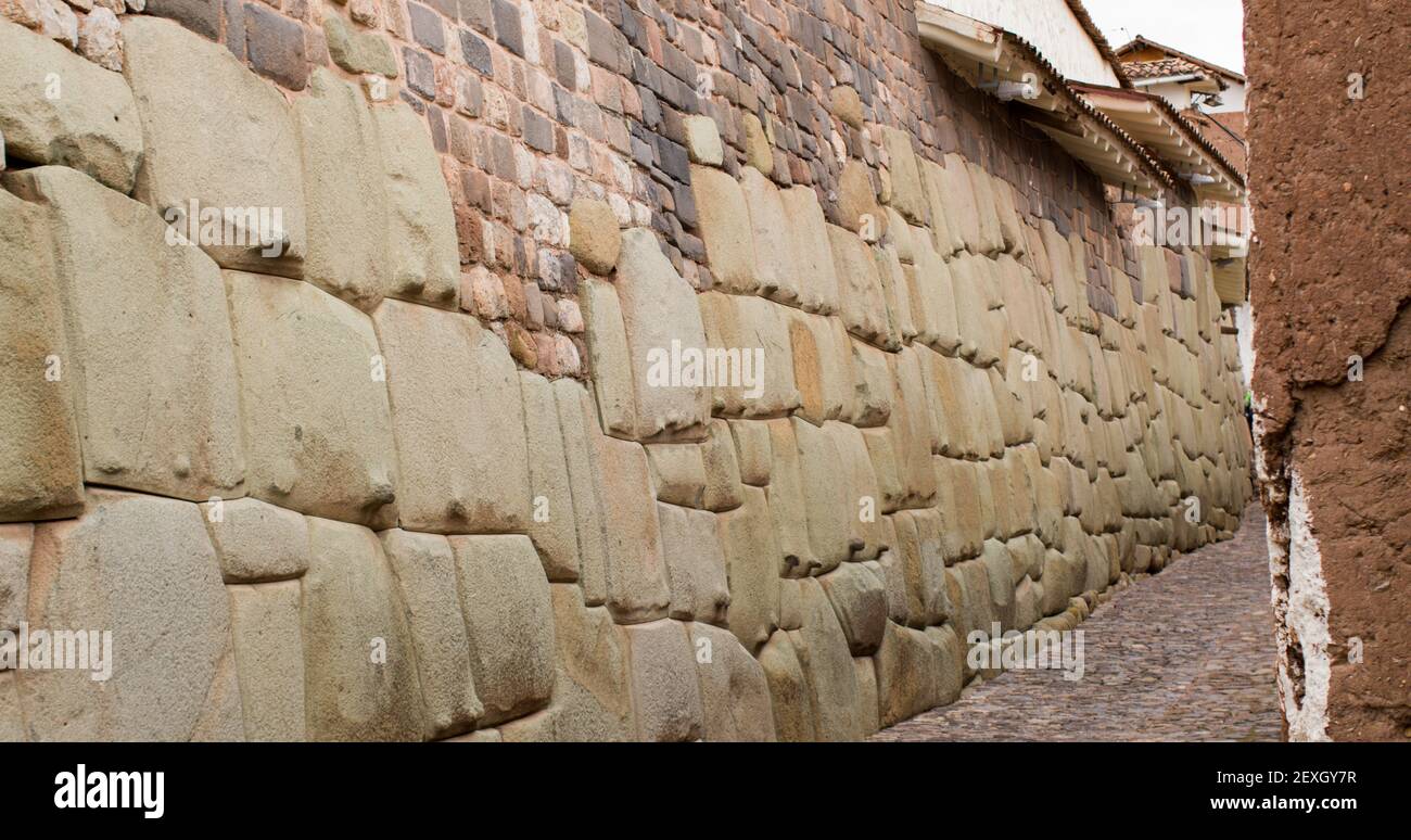Megalithic stone walls up ancient street in ancient city of cusco Stock ...