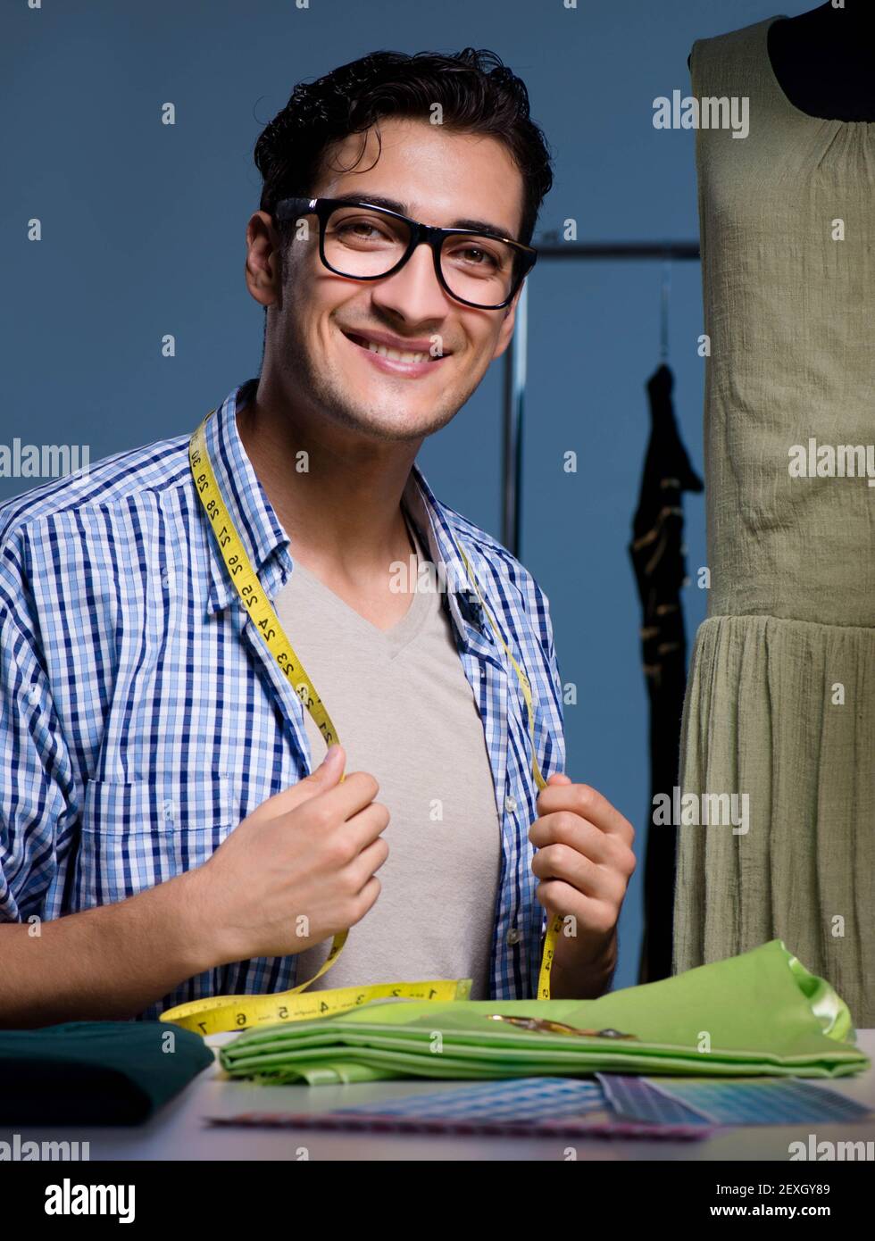 The male tailor working in sewer shop Stock Photo - Alamy