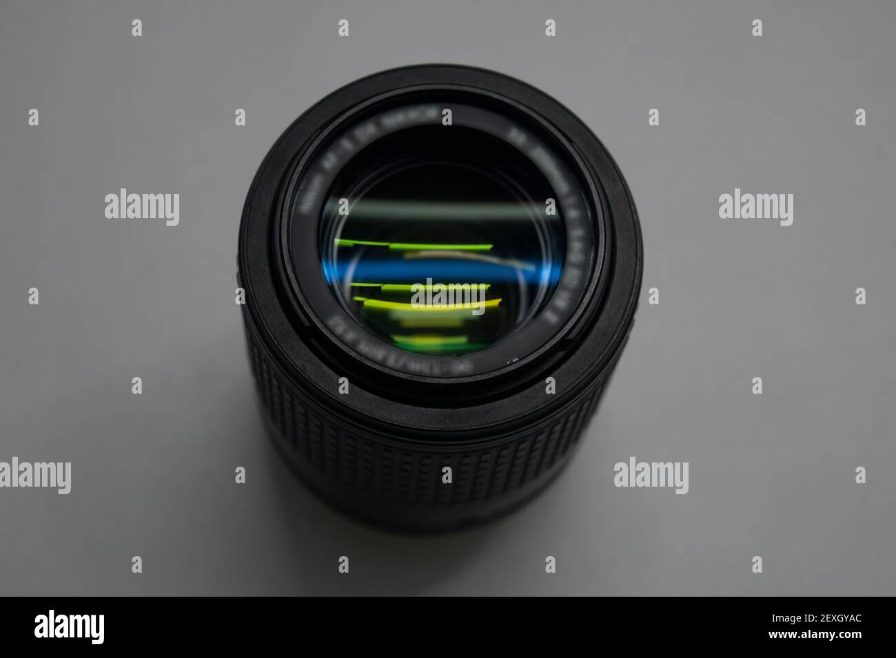 A top view of the camera lens with reflecting lights on the gray ...