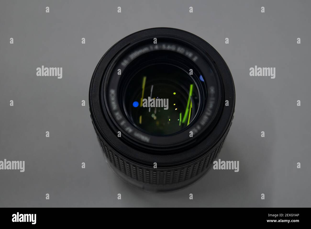 A top view of the camera lens with reflecting lights on the gray ...
