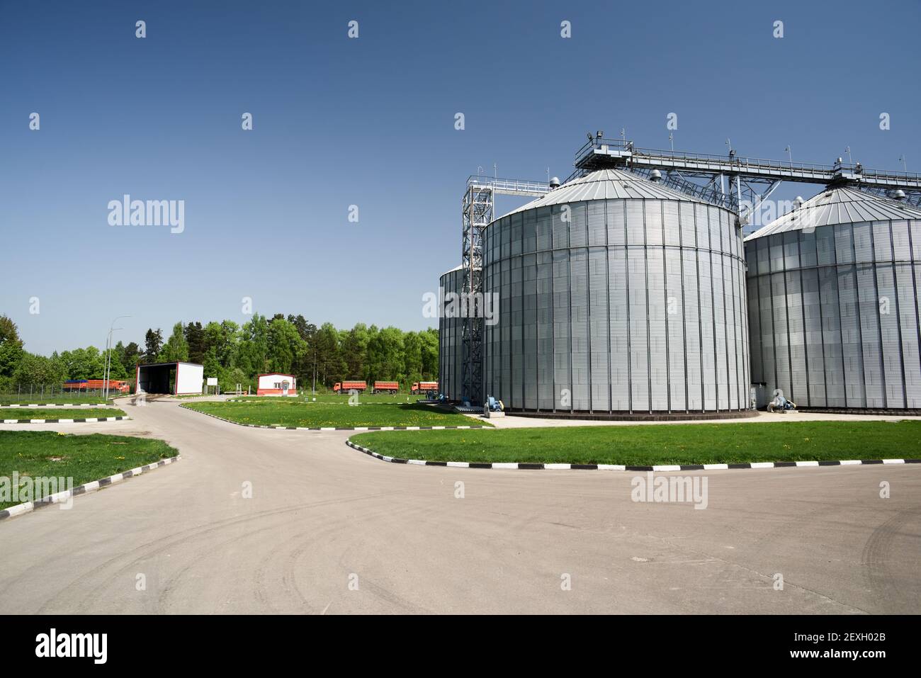 Modern animal feed factory granary. Big metal storage containers for ...