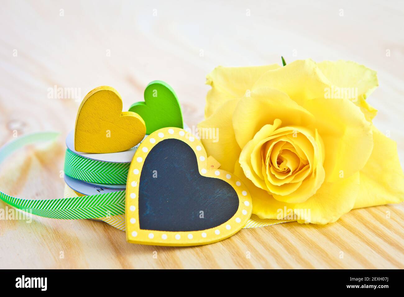 Yellow rose with gift tag Stock Photo - Alamy