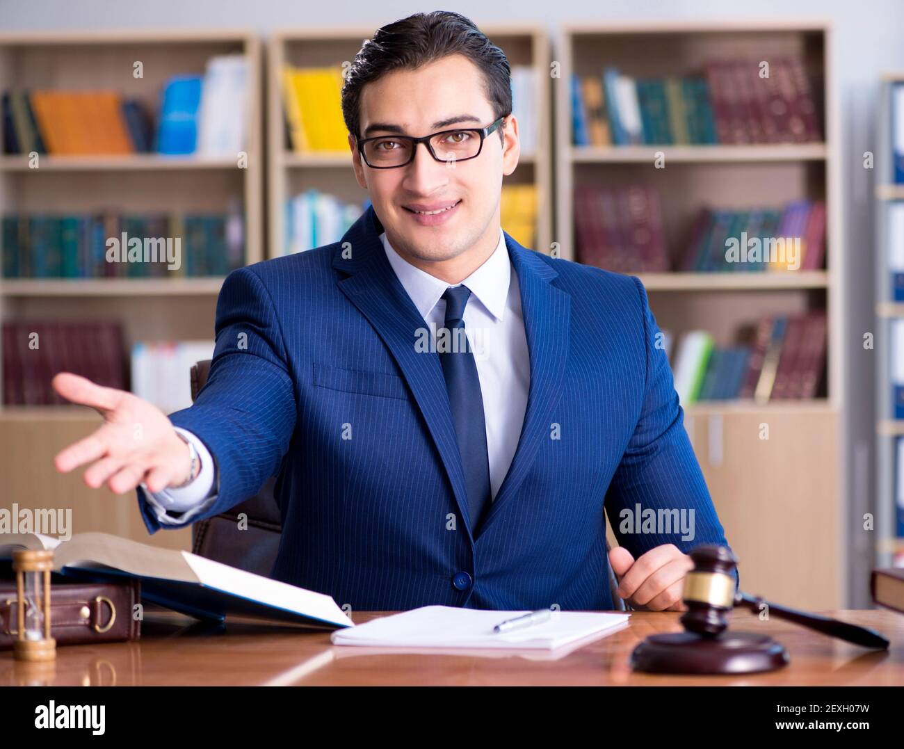 The handsome judge with gavel sitting in courtroom Stock Photo - Alamy