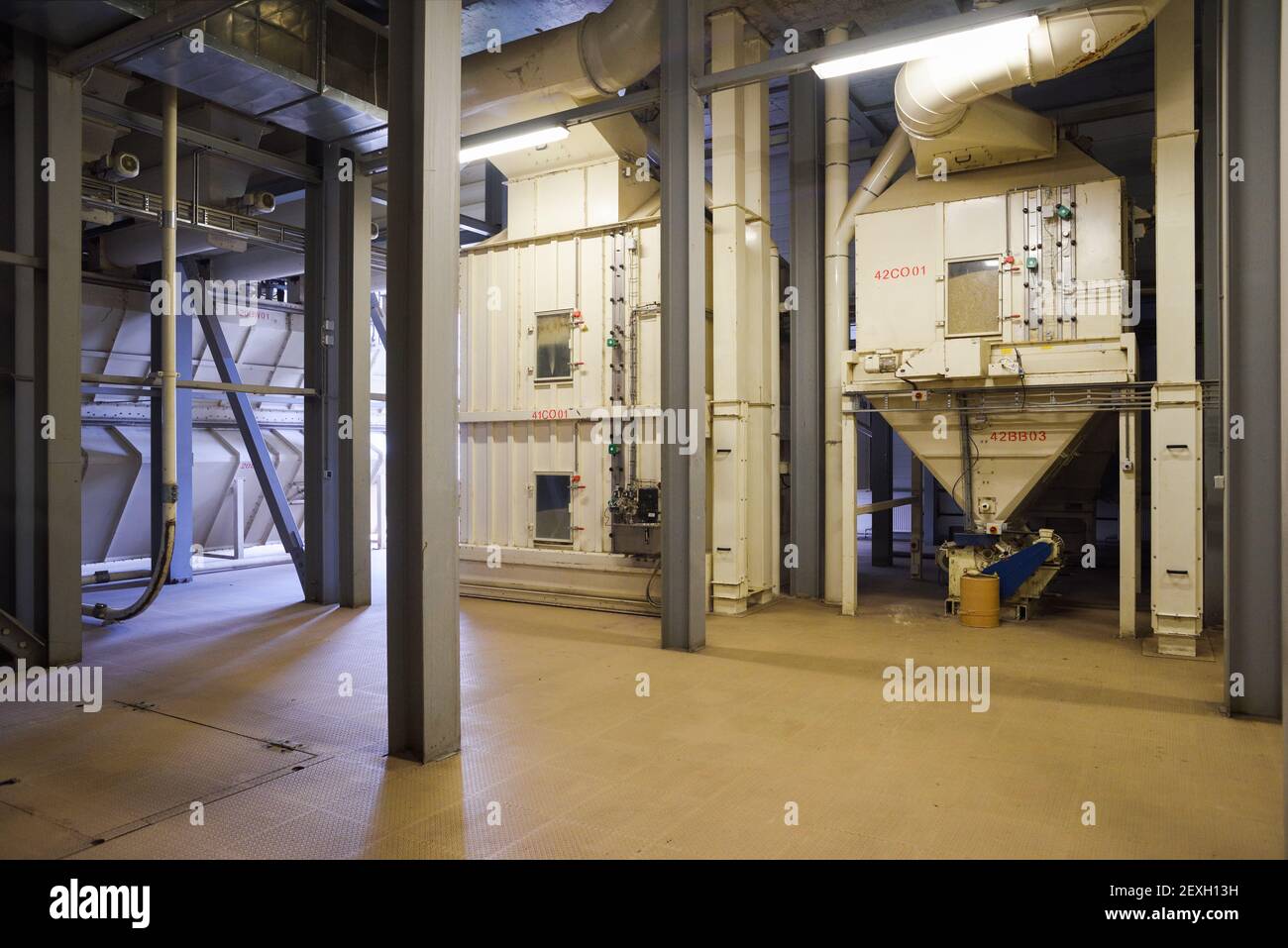 Animal feed factory. New industrial interior of empty warehouse with ...